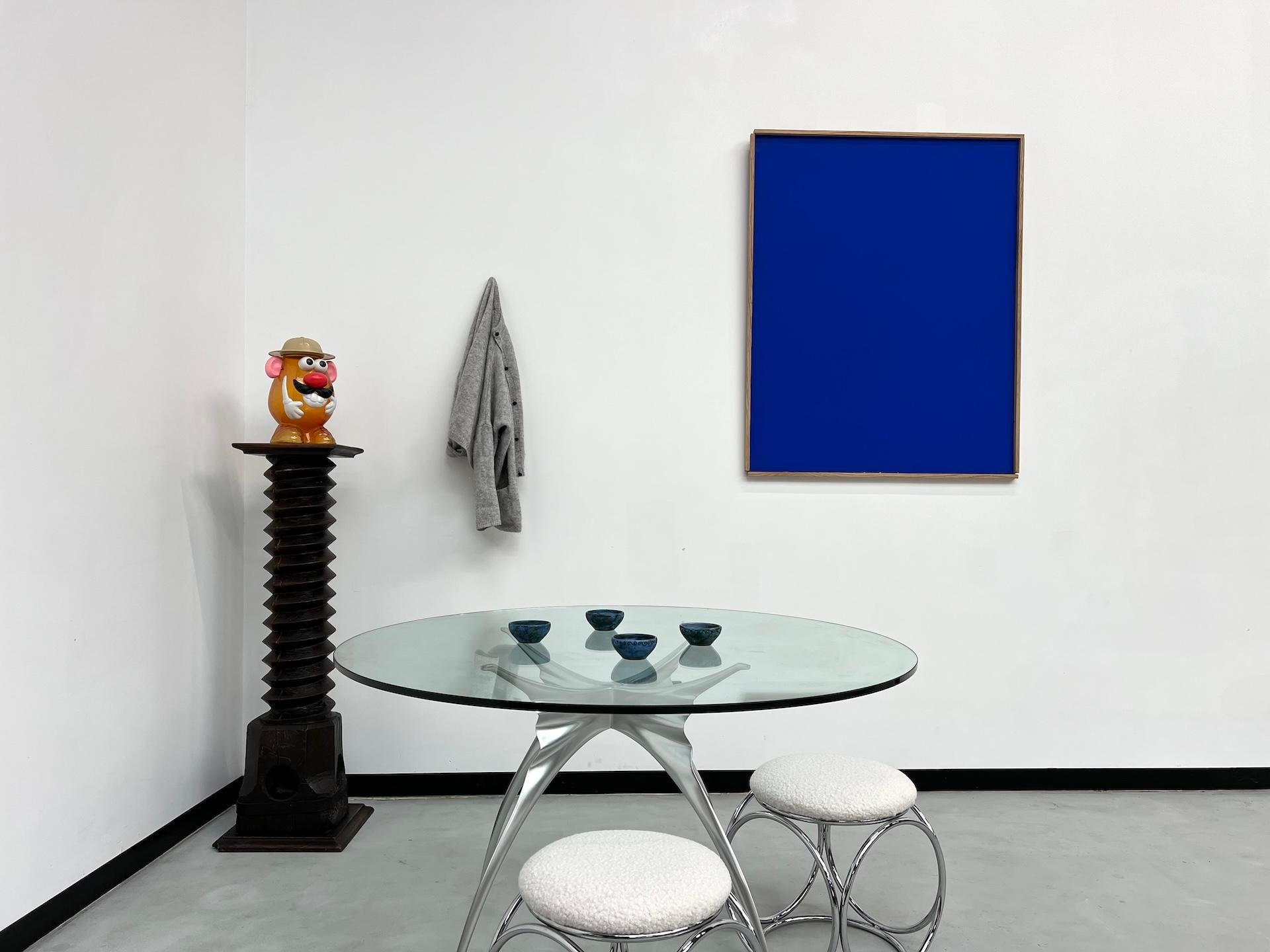 Glass and cast aluminum dining table, circa 1980 For Sale at 1stDibs