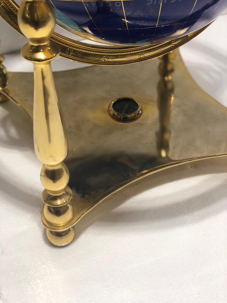 Globe, Solid Rotating Brass Frame with Spinning Globe For Sale at 1stDibs