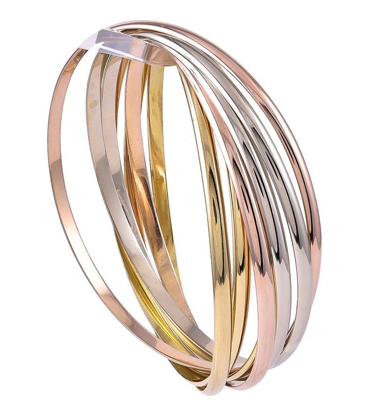 Gold Cartier Paris 7-Band Trinity Bracelet at 1stDibs | cartier rolling ...