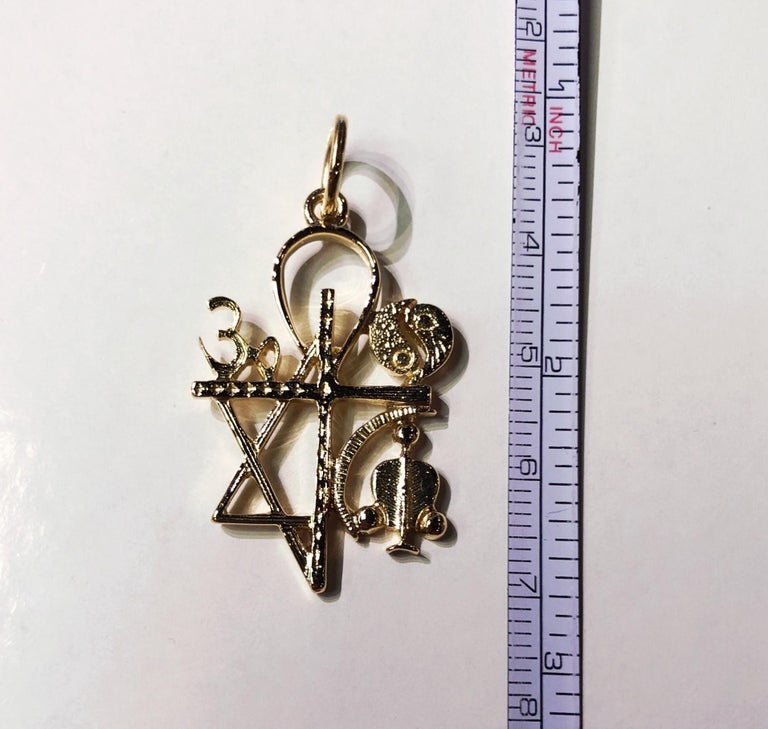 Gold Cartier World Religions Pendant at 1stDibs