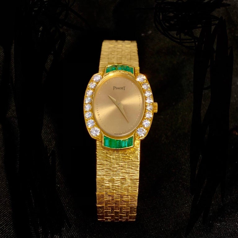 Gold Piaget with Diamonds and Emeralds and Quartz Movement at 1stDibs