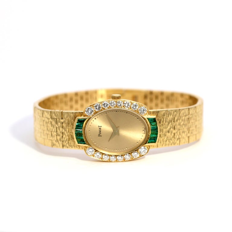 Gold Piaget with Diamonds and Emeralds and Quartz Movement at 1stDibs