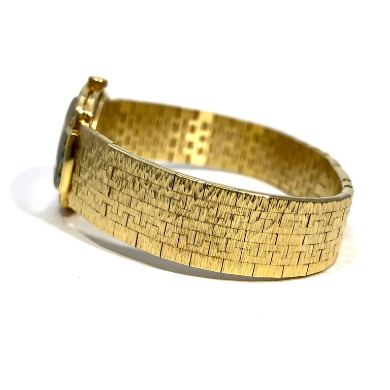 Gold Piaget with Diamonds and Emeralds and Quartz Movement at 1stDibs