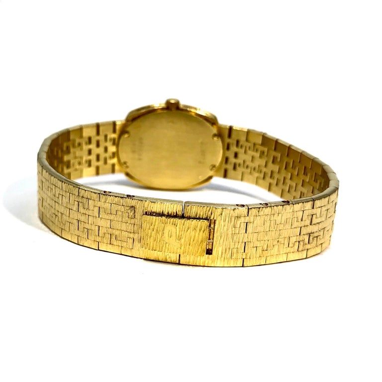 Gold Piaget with Diamonds and Emeralds and Quartz Movement at 1stDibs