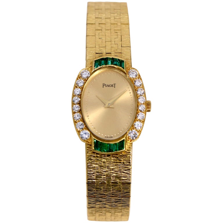 Gold Piaget with Diamonds and Emeralds and Quartz Movement at 1stDibs