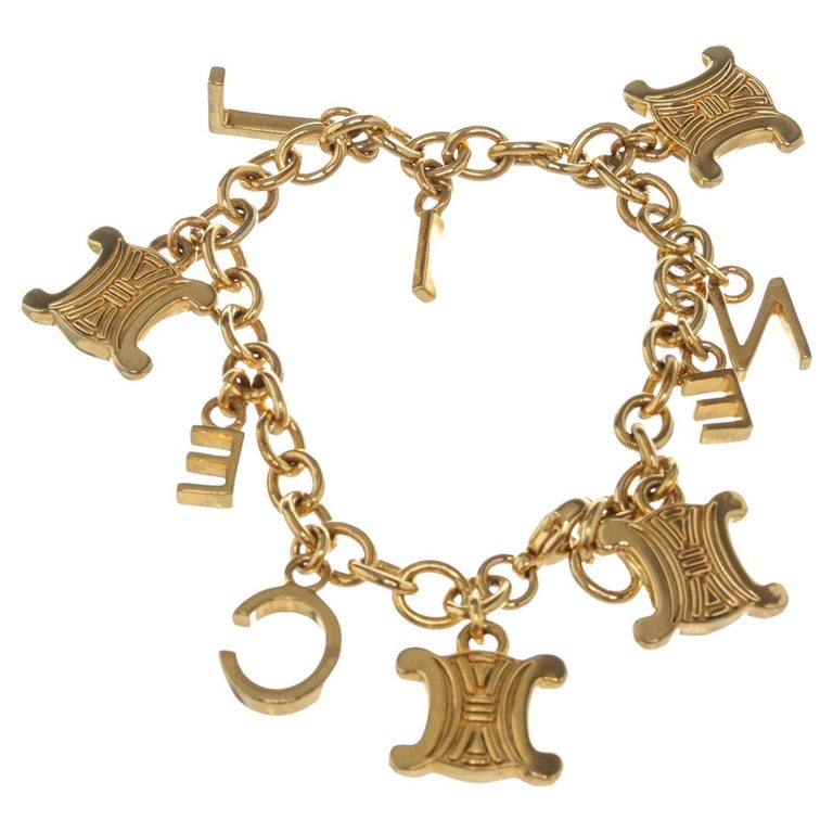 Gold-tone Celine bracelet with multi-charm Celine letters, Macadam logo ...