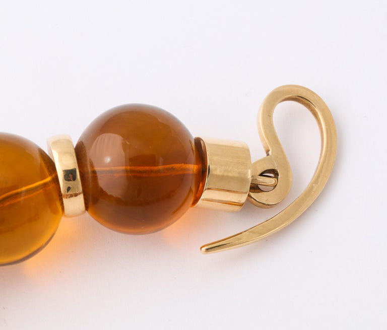 Graduated Reconstituted Amber and 18 Karat Yellow Gold Rondel Necklace ...