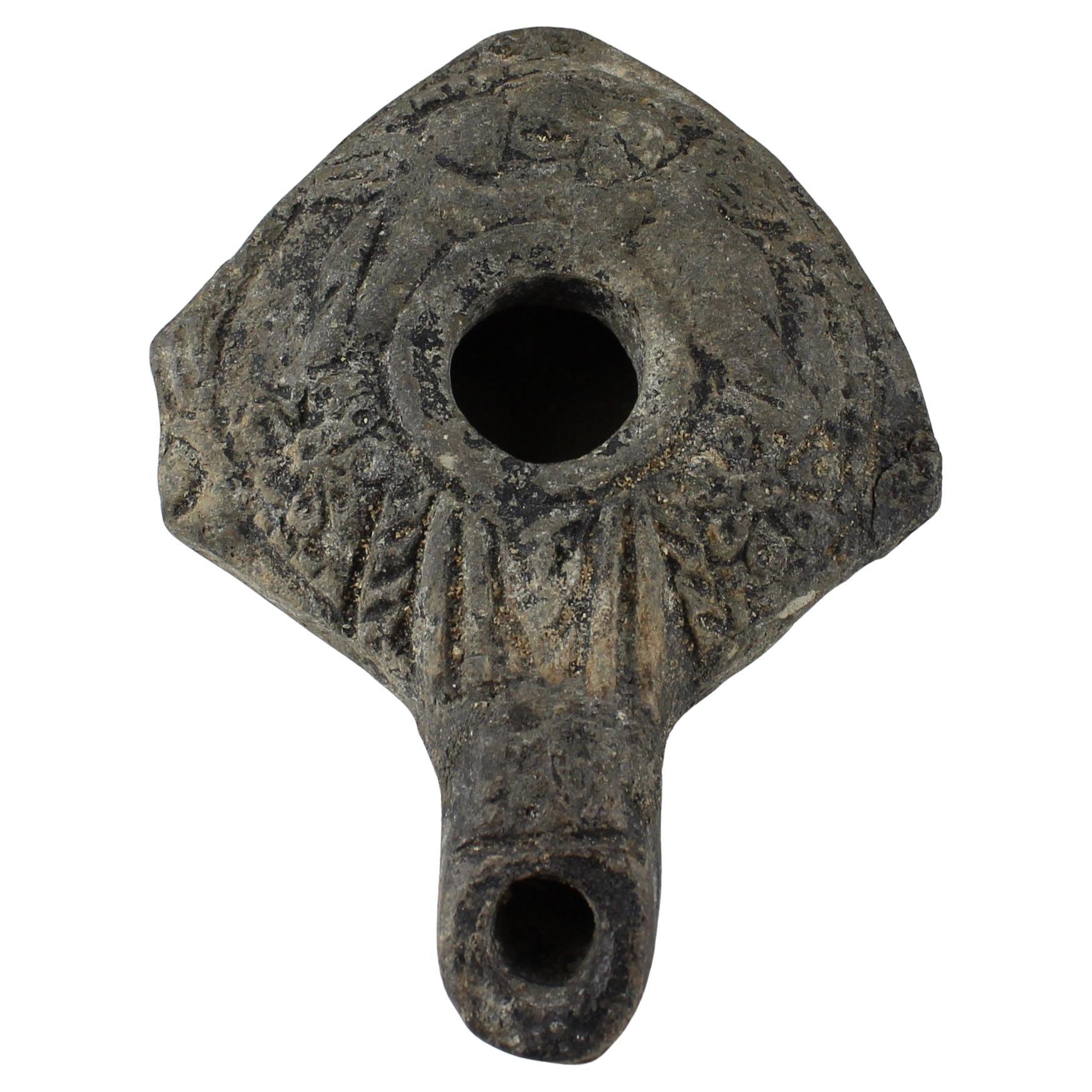 Greek oil lamp with confronted Eros For Sale at 1stDibs