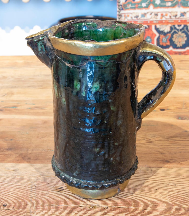 Green Glazed Ceramic Jug with Metal Strengthening For Sale at 1stDibs