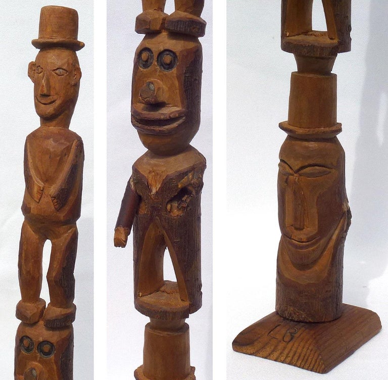 Group of three folky carved totems by the same maker. One is initialled ...