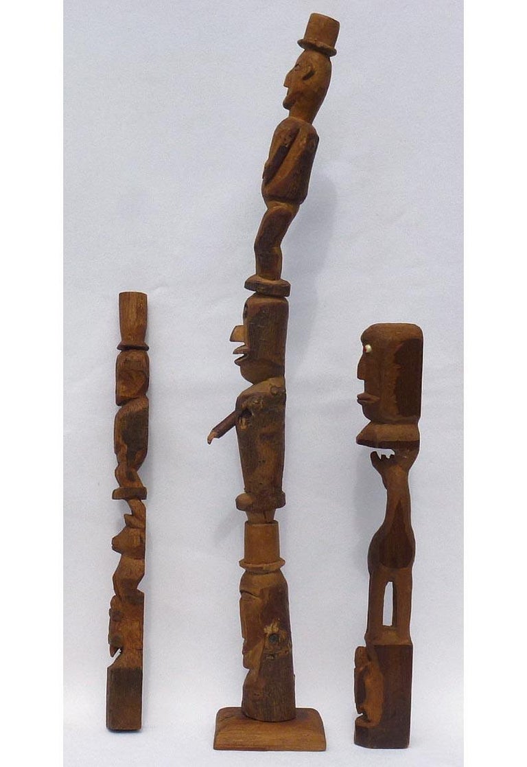 Group of three folky carved totems by the same maker. One is initialled ...