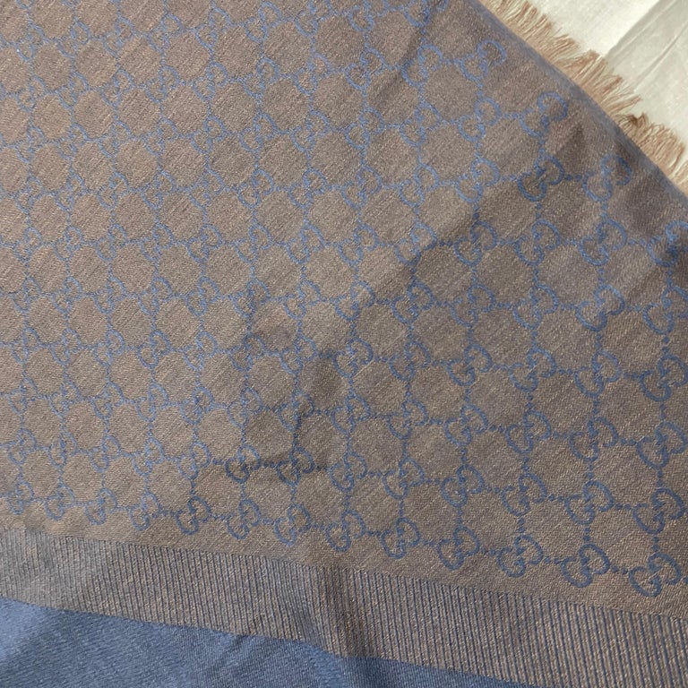 A Gucci Blue Scarf in Wool and Silk with Gucci motif Continuous Logo ...