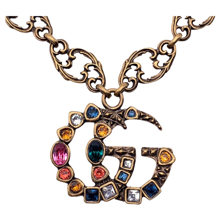 Gucci Collier à chaîne en métal doré avec pendentif GG en cristal ...