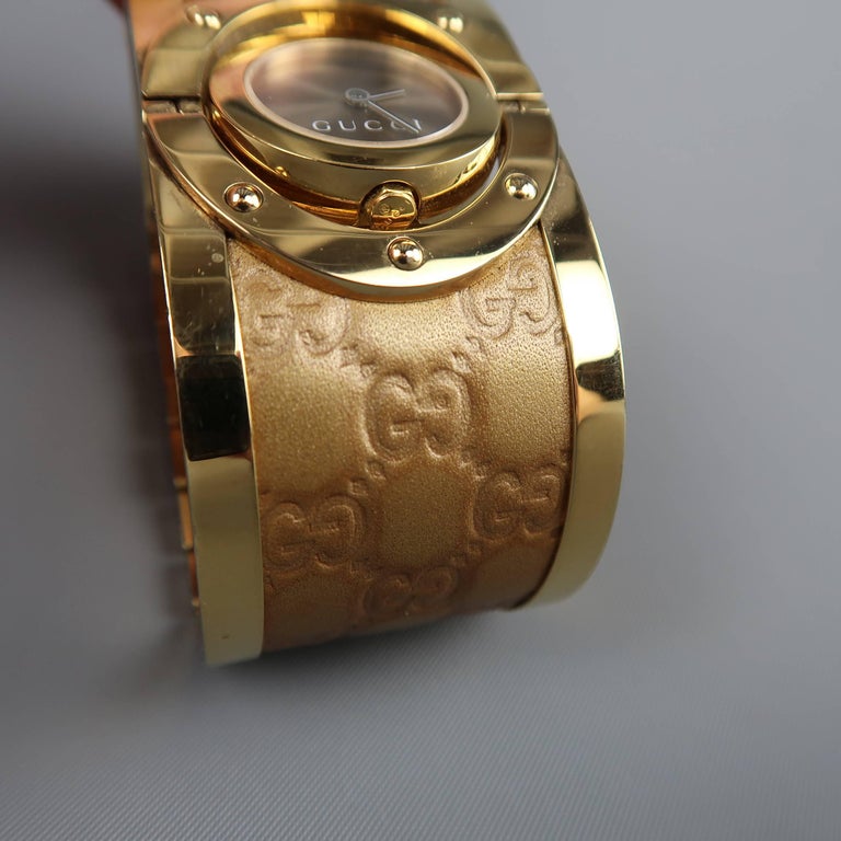 Gucci Gold Metal Monogram Leather Twirl Collection Wristwatch at 1stDibs