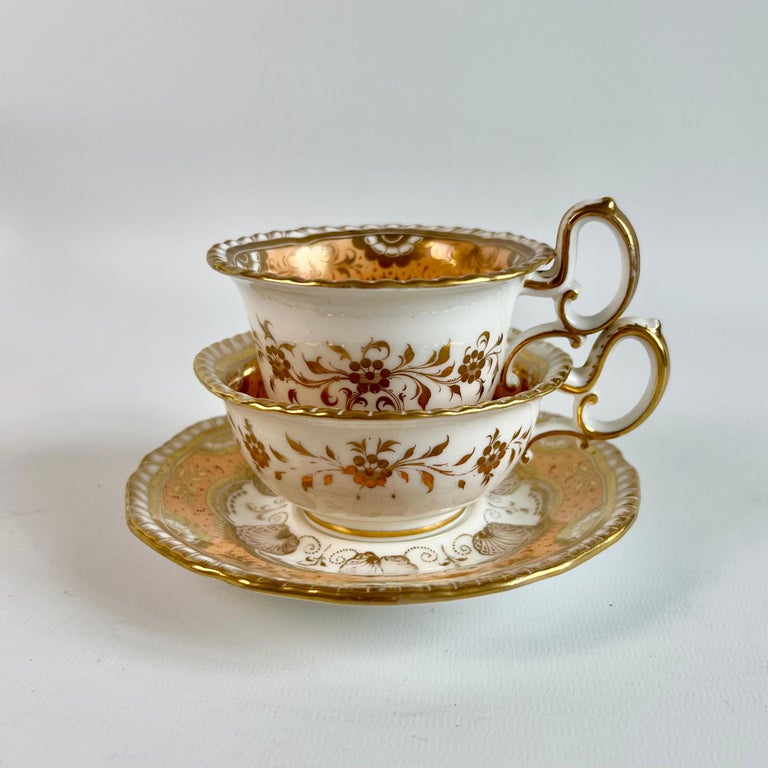 H and R Daniel Porcelain Teacup Trio, Peach and Gilt Shells, Regency ca ...