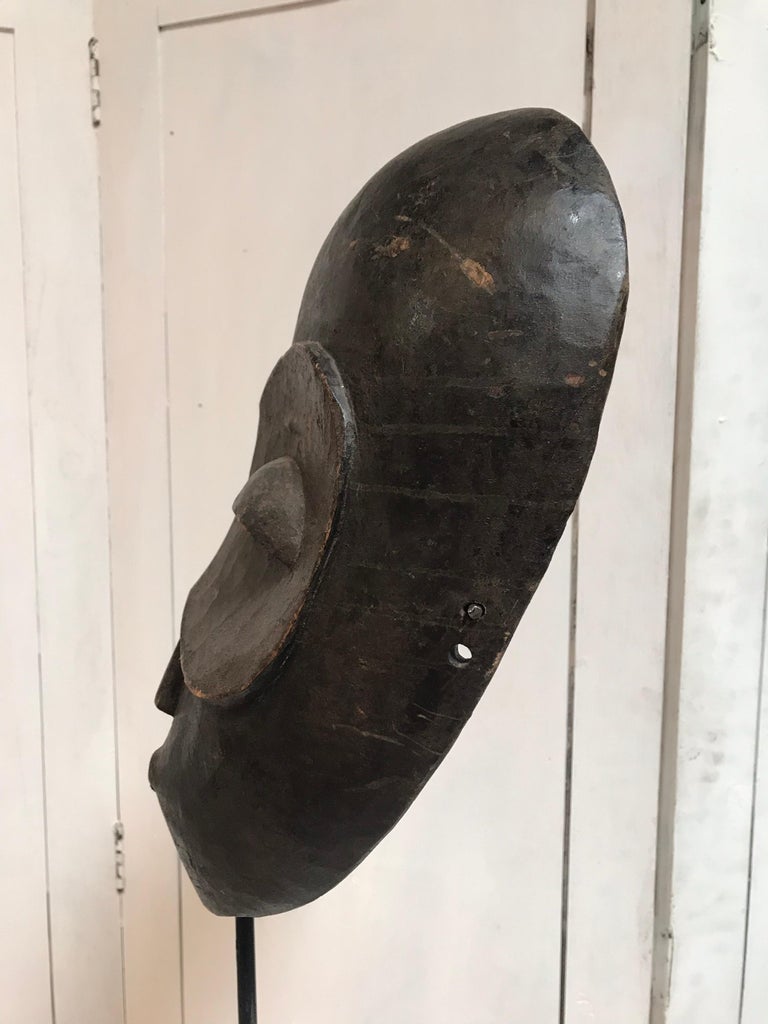 Hand Carved African Wooden Mask on Stand For Sale at 1stDibs