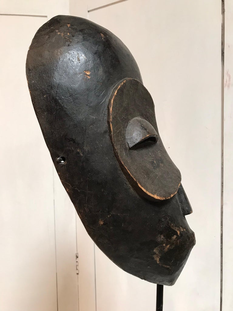 Hand Carved African Wooden Mask on Stand For Sale at 1stDibs