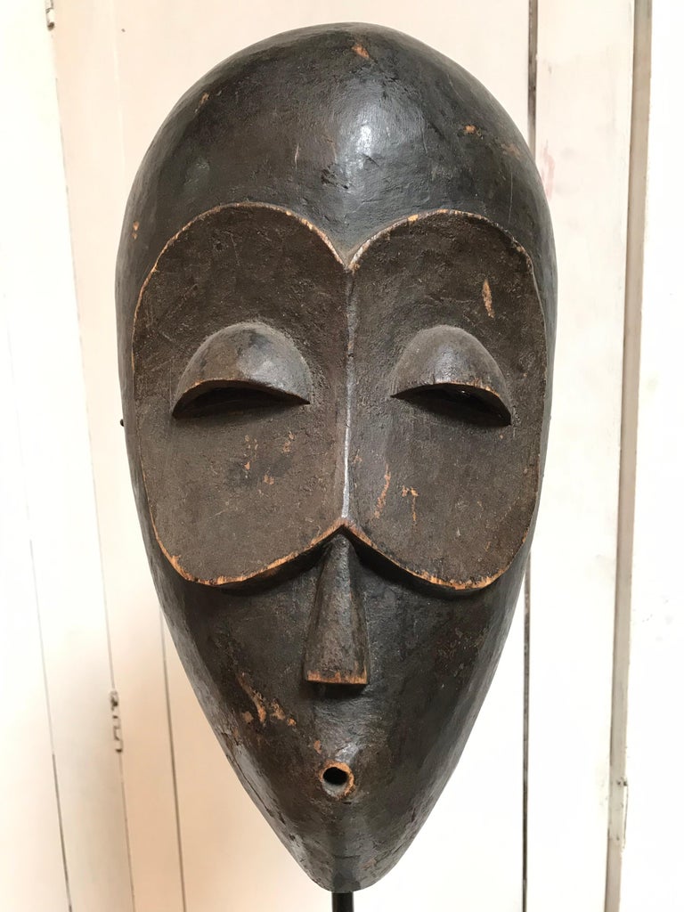 Hand Carved African Wooden Mask on Stand For Sale at 1stDibs