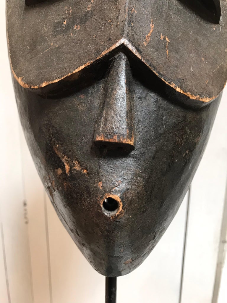 Hand Carved African Wooden Mask on Stand For Sale at 1stDibs