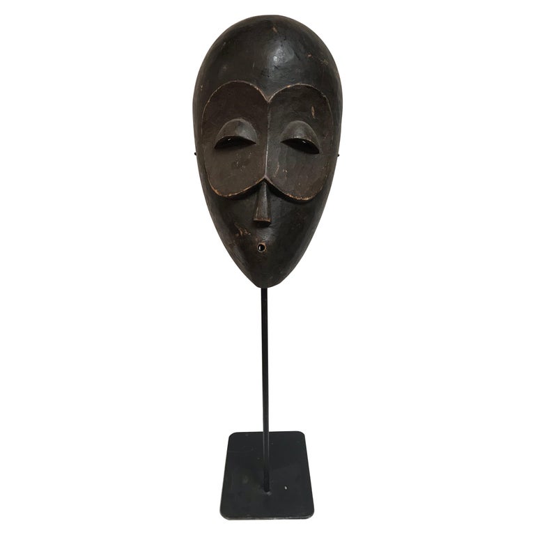Hand Carved African Wooden Mask on Stand For Sale at 1stDibs
