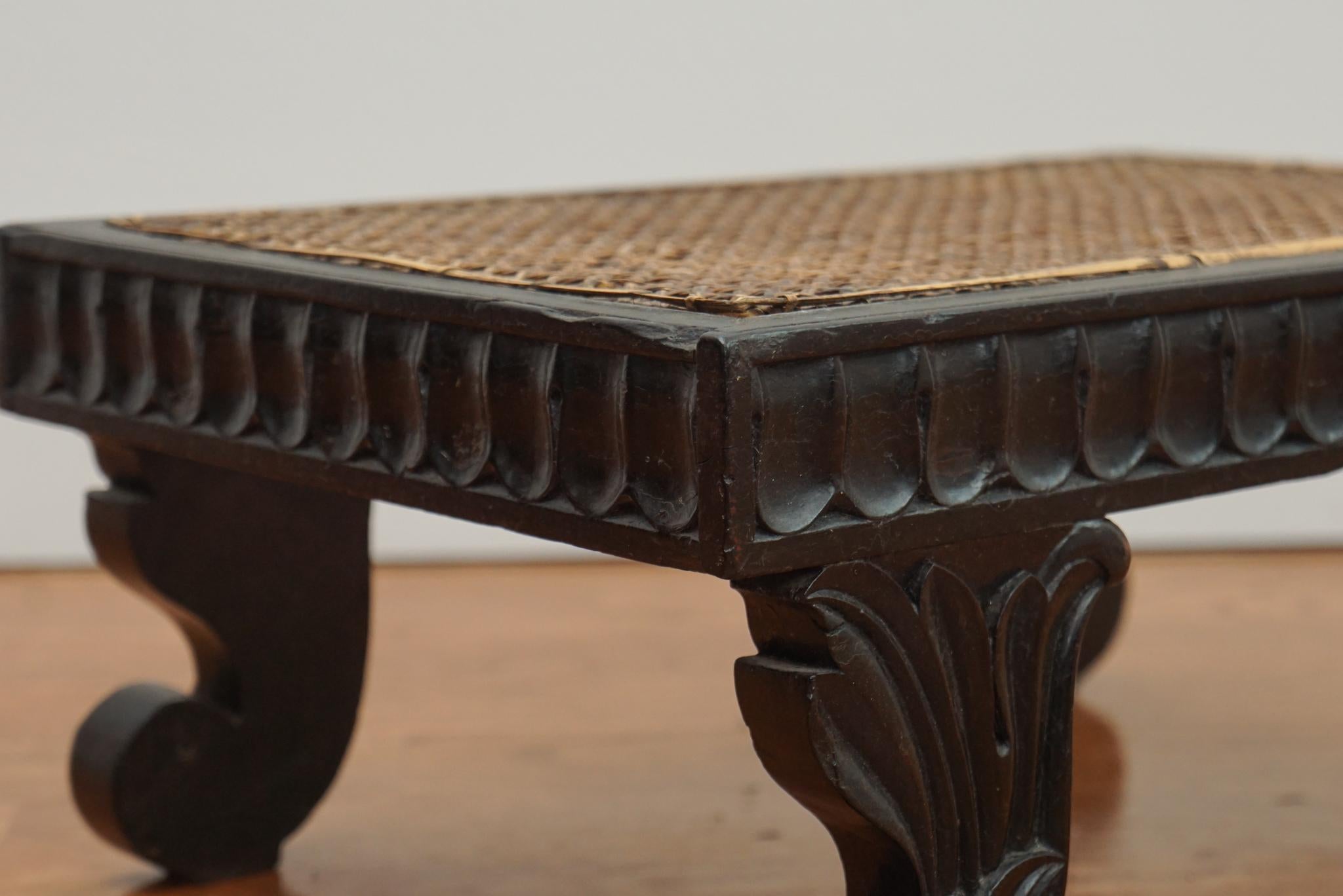 Hand-Carved Ebony Caned Foot Stool For Sale at 1stDibs