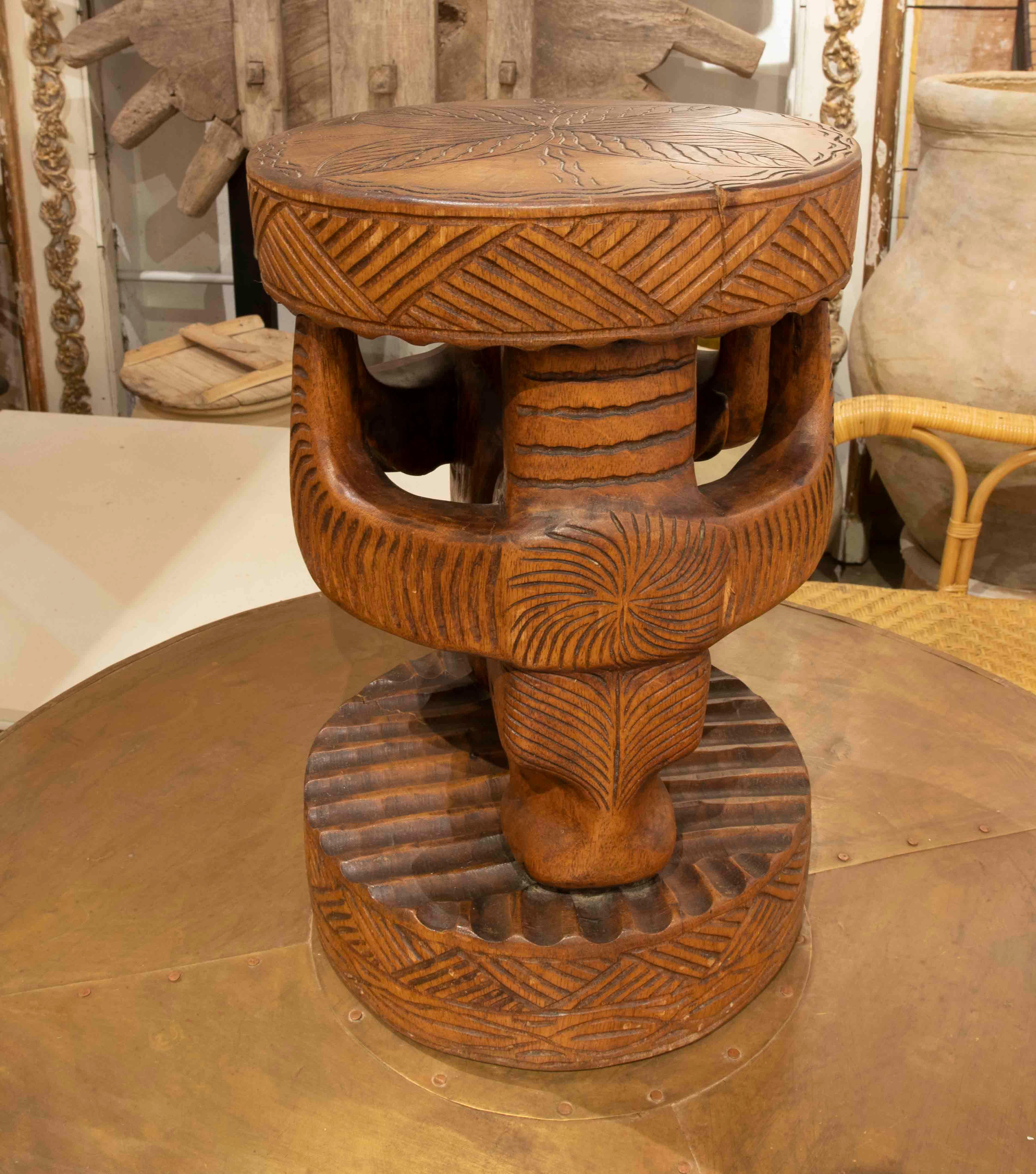 Hand-Carved Wooden Stool with Animal Heads For Sale at 1stDibs