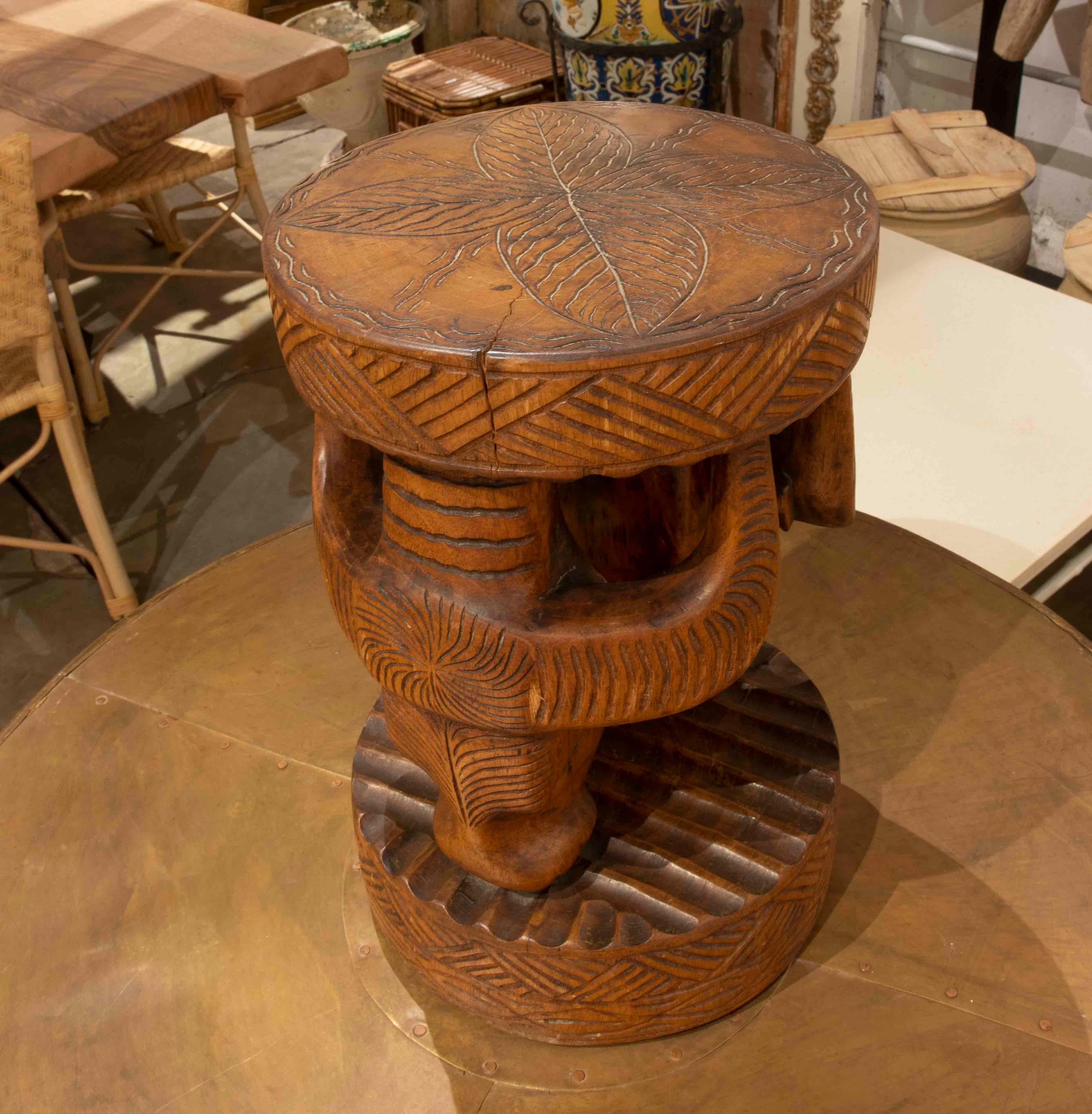 Hand-Carved Wooden Stool with Animal Heads For Sale at 1stDibs