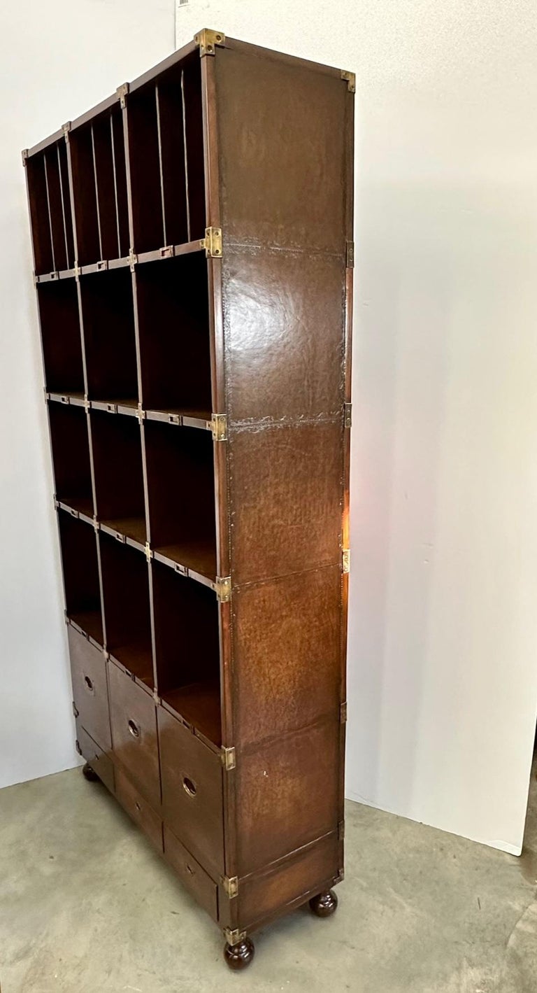 Handsome Campaign Style Leather Wrapped Bookcase For Sale at 1stDibs