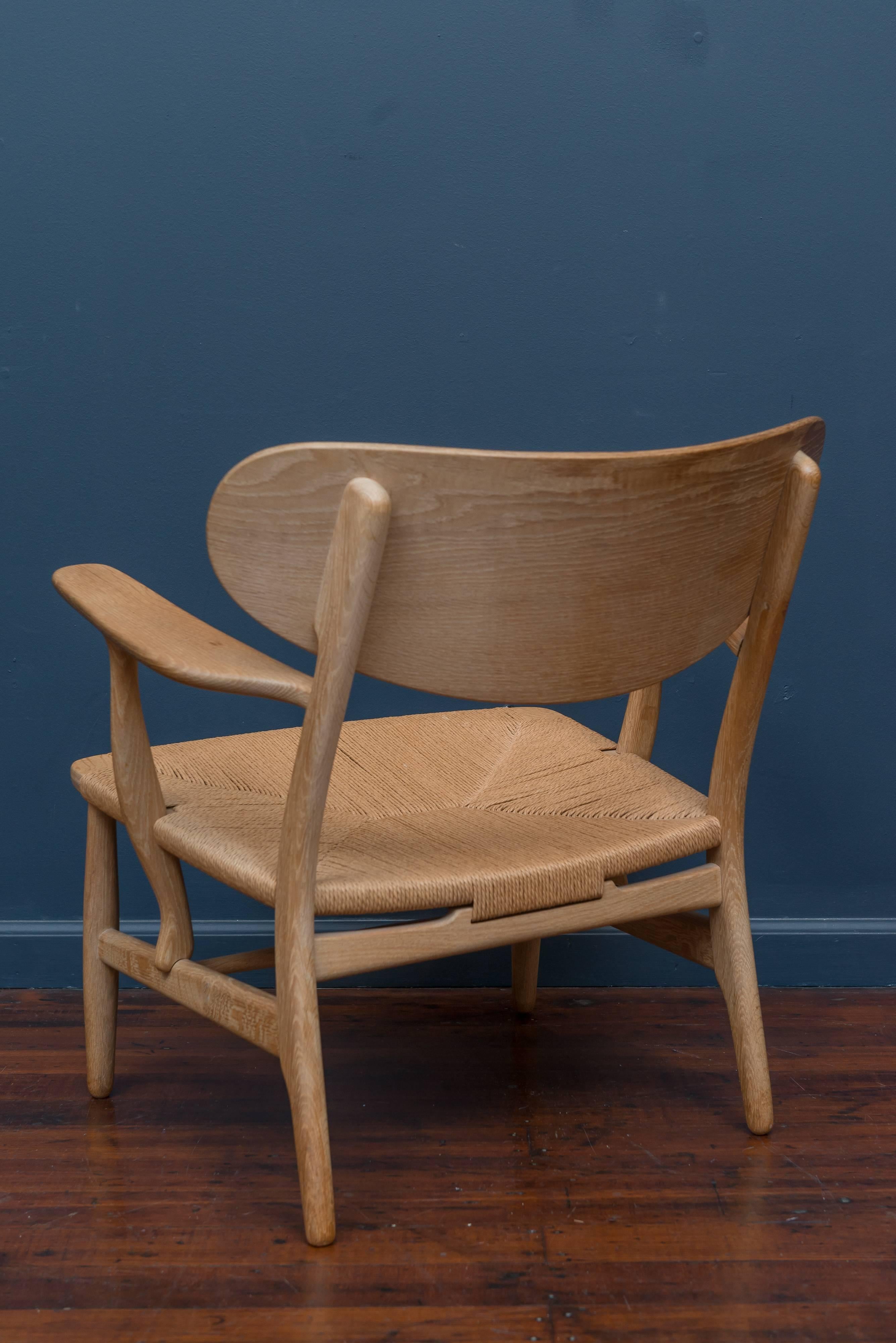 Hans Wegner CH 22 Easy Chair at 1stDibs | wegner sign, panish