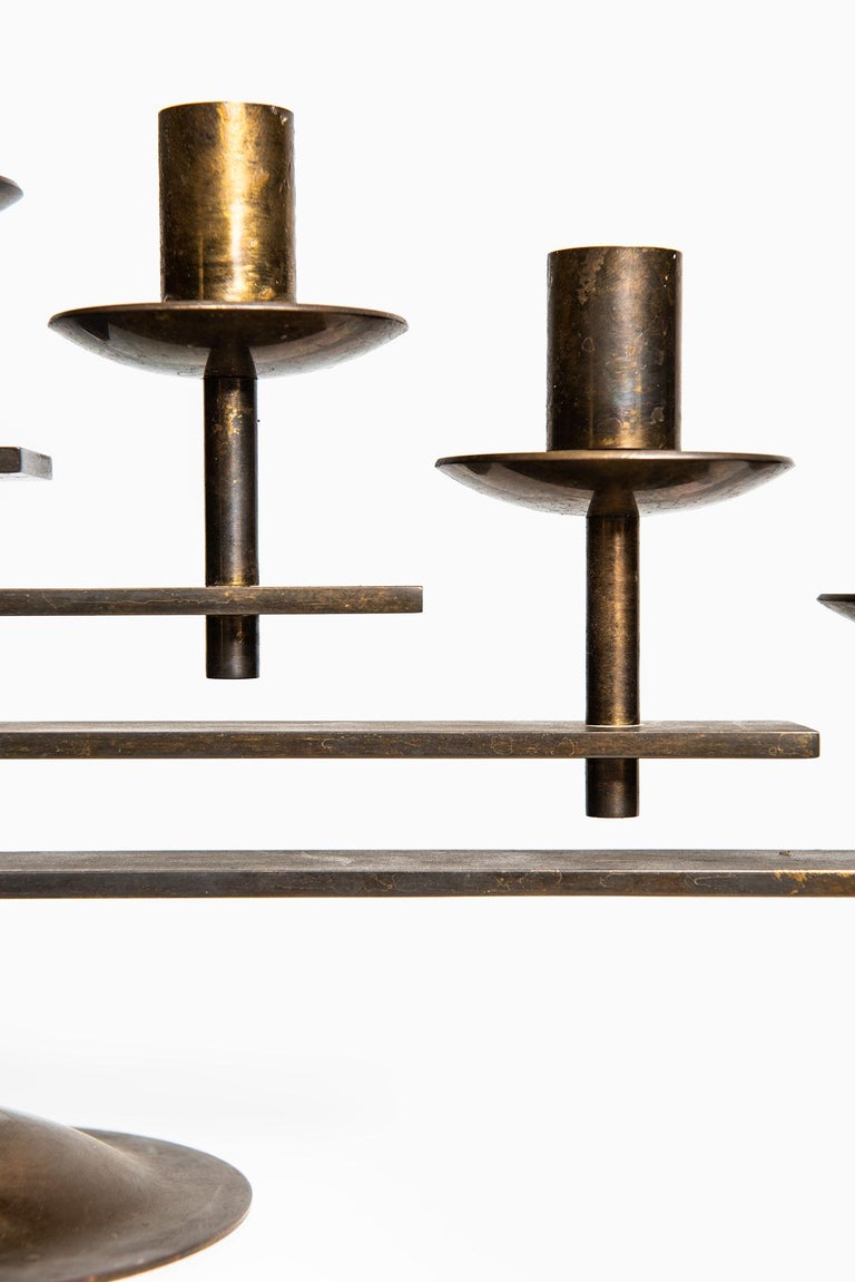 Heavy candlestick in brass produced in Denmark For Sale at 1stDibs