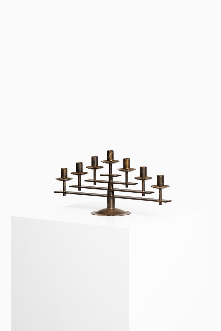Heavy candlestick in brass produced in Denmark For Sale at 1stDibs