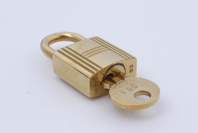 Hermes Cadena Lock and Keys with gold-plated hardware, one padlock and ...