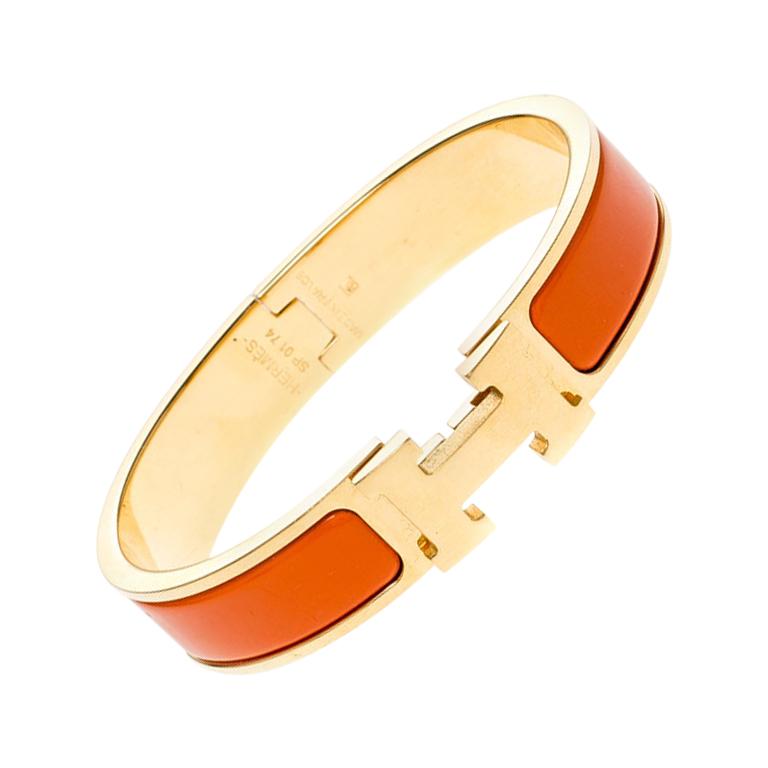 Hermes Clic Clac H Orange Enamel Gold Plated Narrow Bracelet PM For Sale at 1stDibs