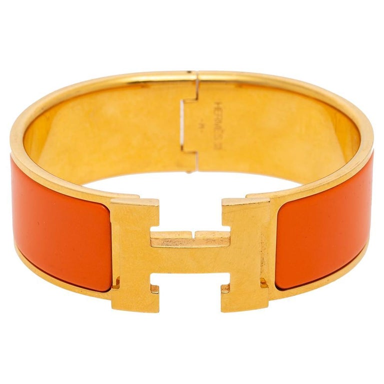 Hermès Clic Clac H Orange Enamel Gold Plated Wide Bracelet at 1stDibs