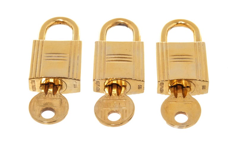 Hermes Gold Cadena Lock Key Set with gold-tone hardware and turn lock ...