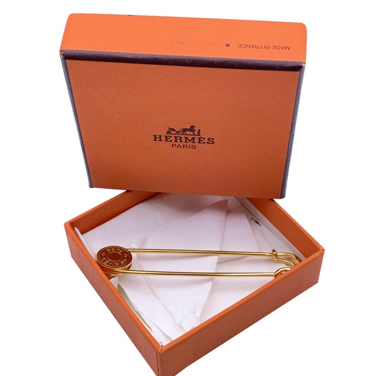 Hermes Gold Metal Clou De Selle Safety Pin Brooch at 1stDibs