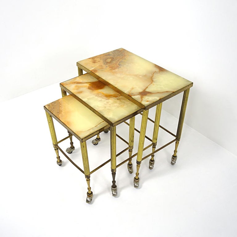 Hollywood Regency Nesting Tables on Wheels Made of Brass With Marble Tops For Sale at 1stDibs