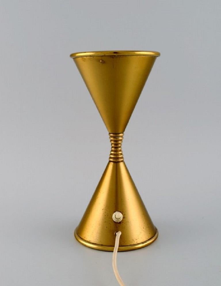 Hourglass-shaped designer table lamp in brass. Mid-20th century. For ...