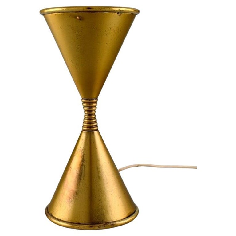 Hourglass-shaped designer table lamp in brass. Mid-20th century. For ...