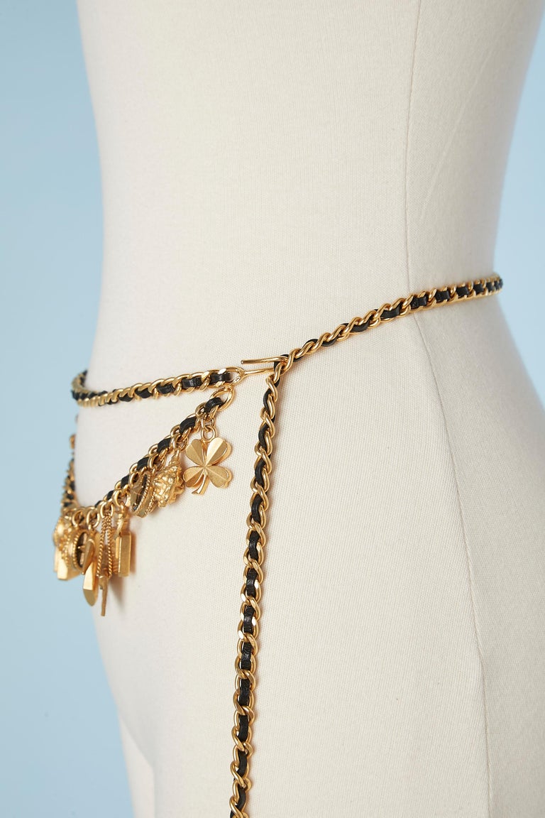 Iconic gold metal charm's on chain and black leather belt Chanel Circa ...
