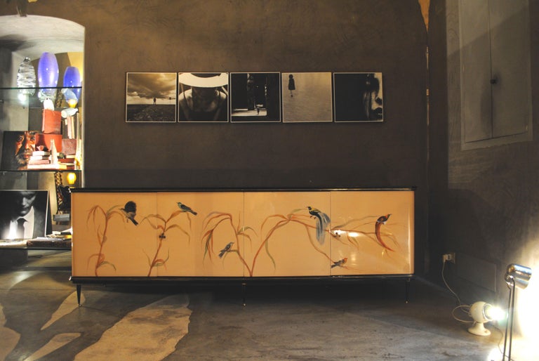 Italian 50s production cabinet sideboard with decorated doors at 1stDibs