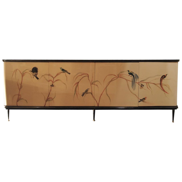 Italian 50s production cabinet sideboard with decorated doors at 1stDibs