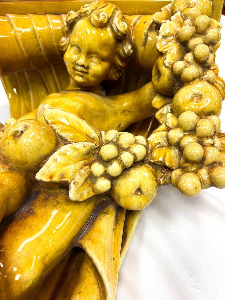 Italian Baroque-Style Glazed Pottery Putto Wall Bracket For Sale at 1stDibs