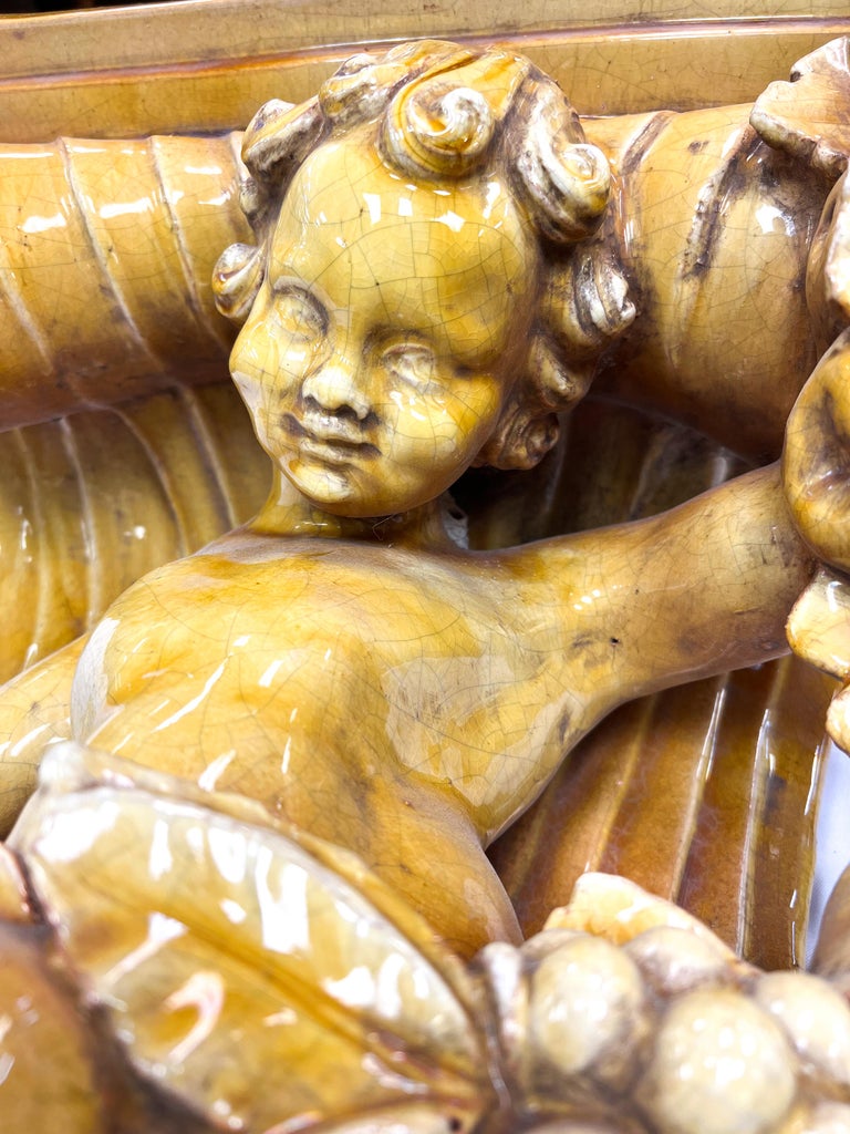 Italian Baroque-Style Glazed Pottery Putto Wall Bracket For Sale at 1stDibs