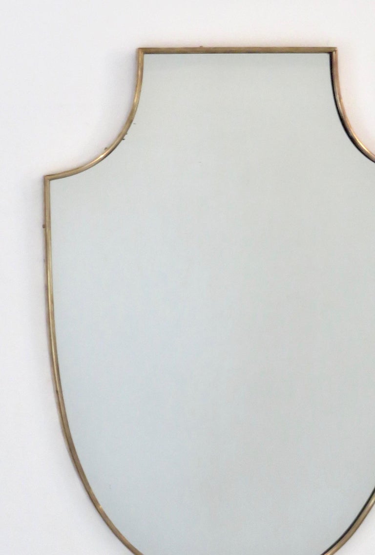 Italian Brass Framed Shield Shaped Vintage Wall Mirror at 1stDibs