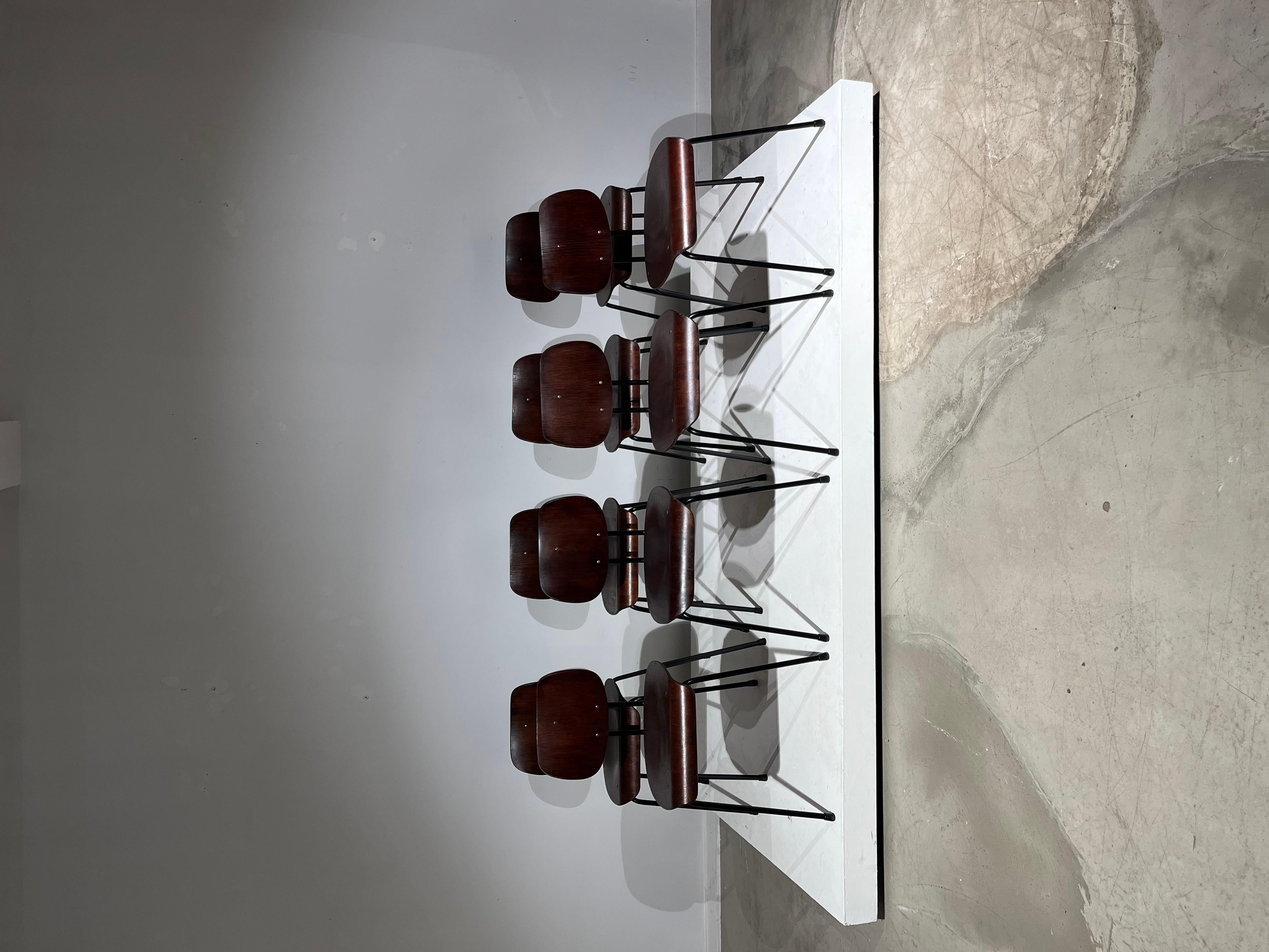 Italian dark brown wood chairs with thin black legs For Sale at 1stDibs