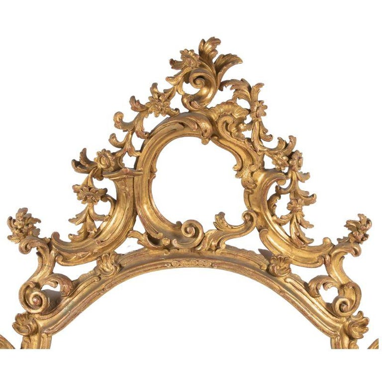 Italian Giltwood Mirror with Floral and Urn Carving For Sale at 1stDibs