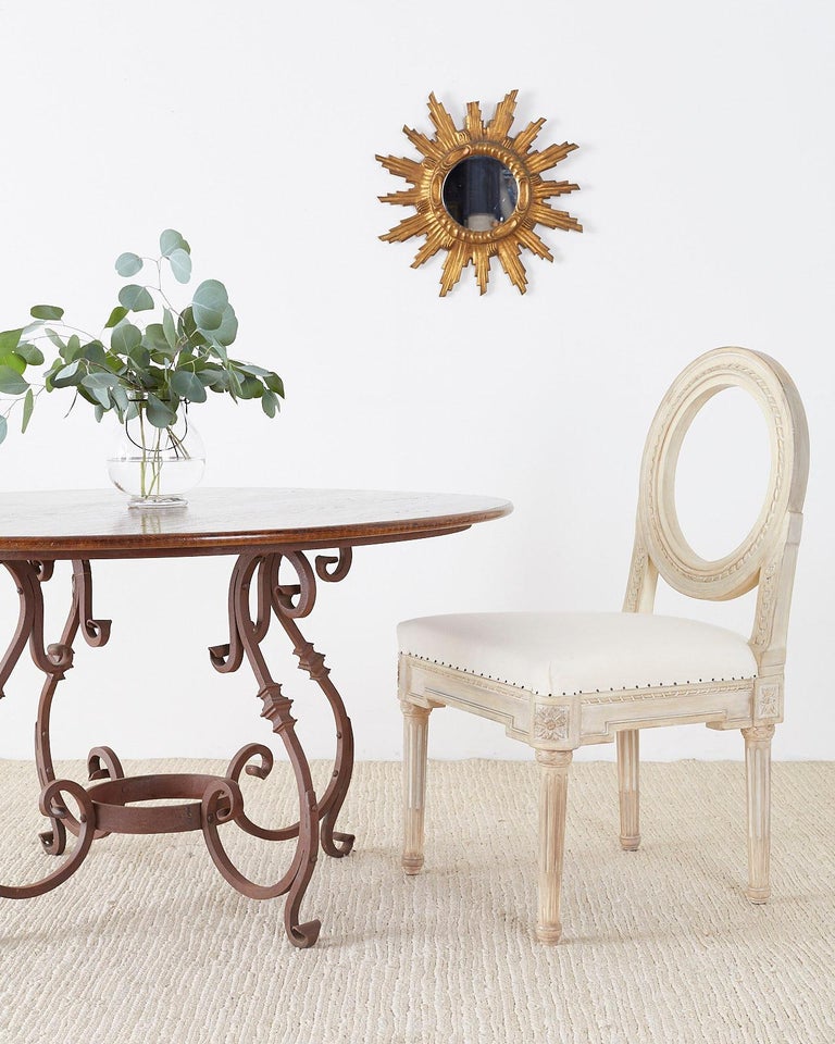 Italian Oak and Scrolled Iron Round Dining Table at 1stDibs