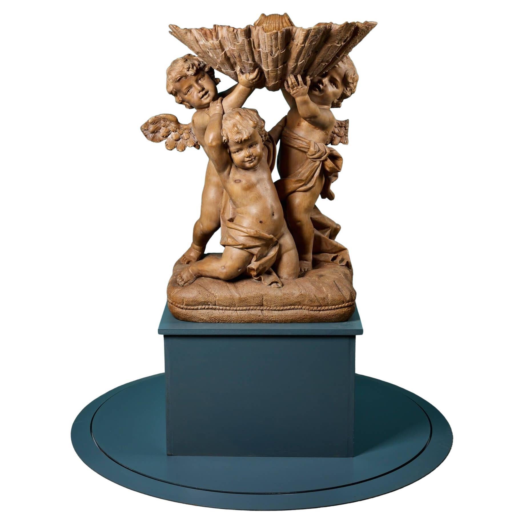 An Italian Hand Carved Pine Putti Statue For Sale at 1stDibs