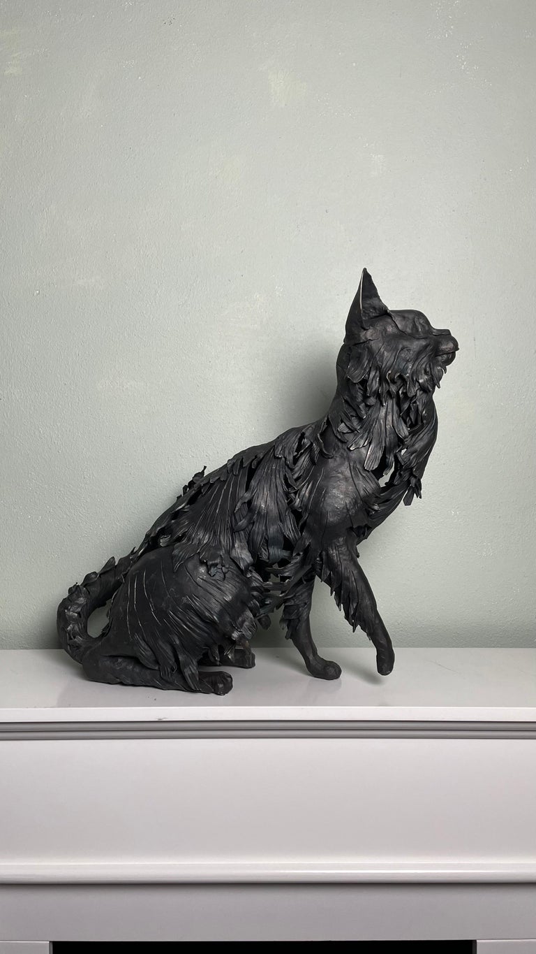 Ivan Zanoni - Cat in playful pose crafted in black wrough iron by ...
